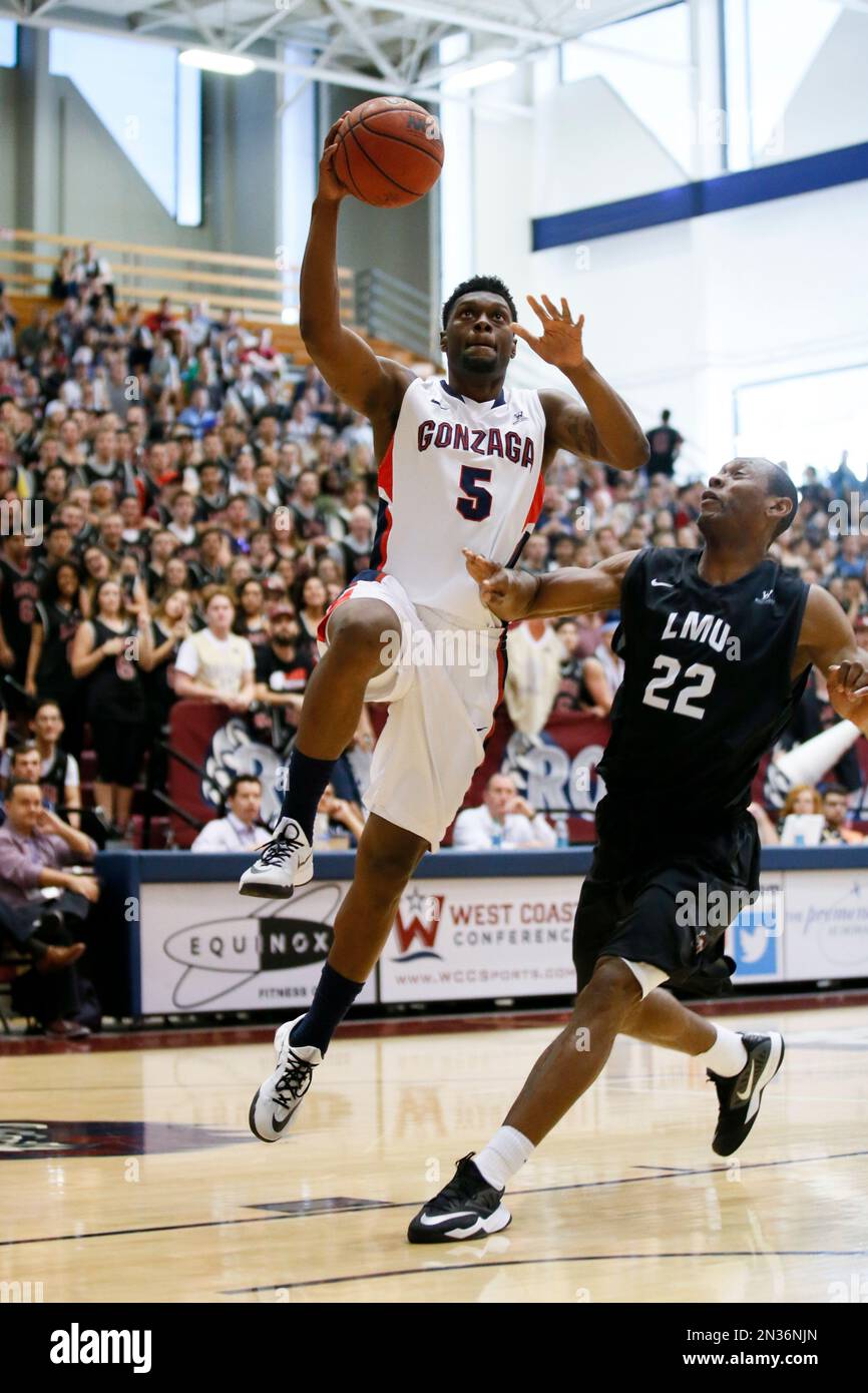 Gonzaga's Gary Bell Jr., left, goes to the hoop over Loyola Marymount's ...