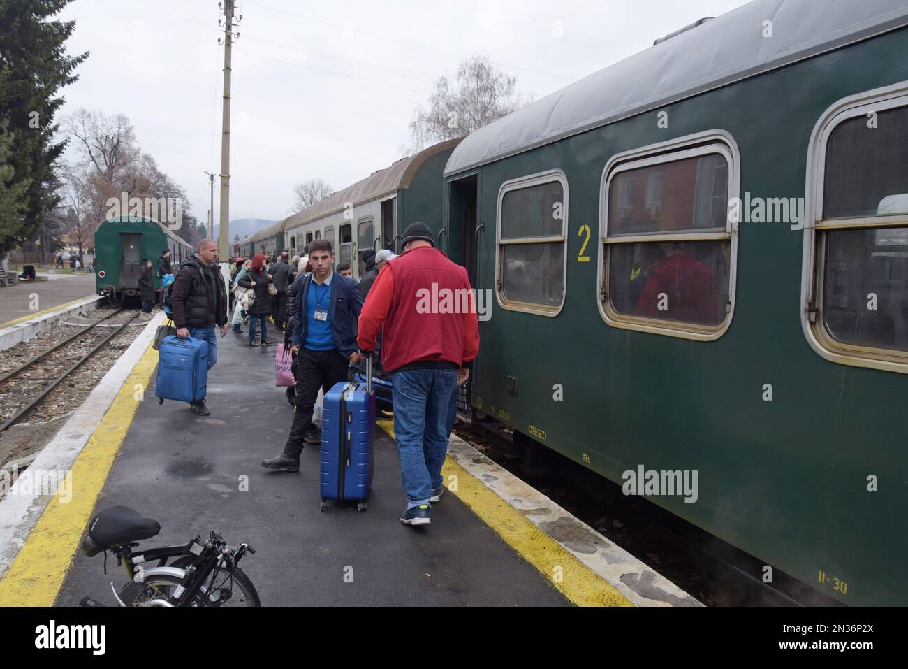 Passengers getting on and off a train at Velingrad station on the ...