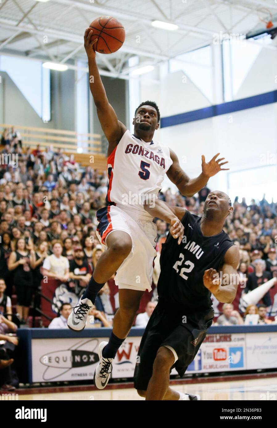 Gonzaga's Gary Bell Jr., left, goes to the hoop over Loyola Marymount's ...