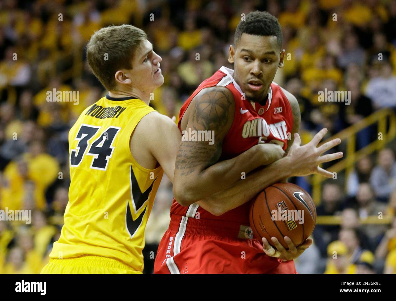 Ohio State center Amir Williams, right, is fouled by Iowa center Adam ...