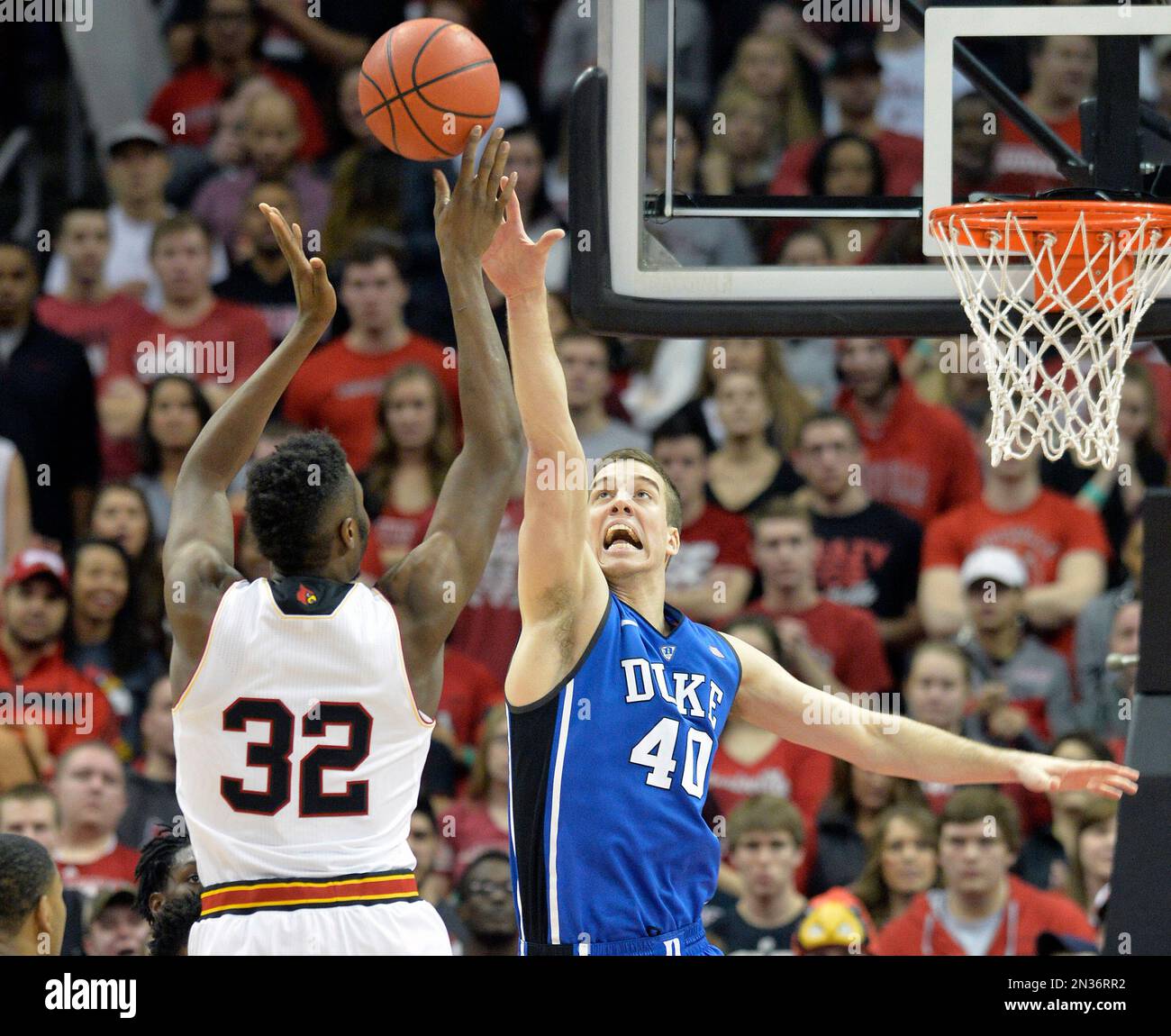 Duke's Marshall Plumlee, right, attempts to block a shot by Louisville ...