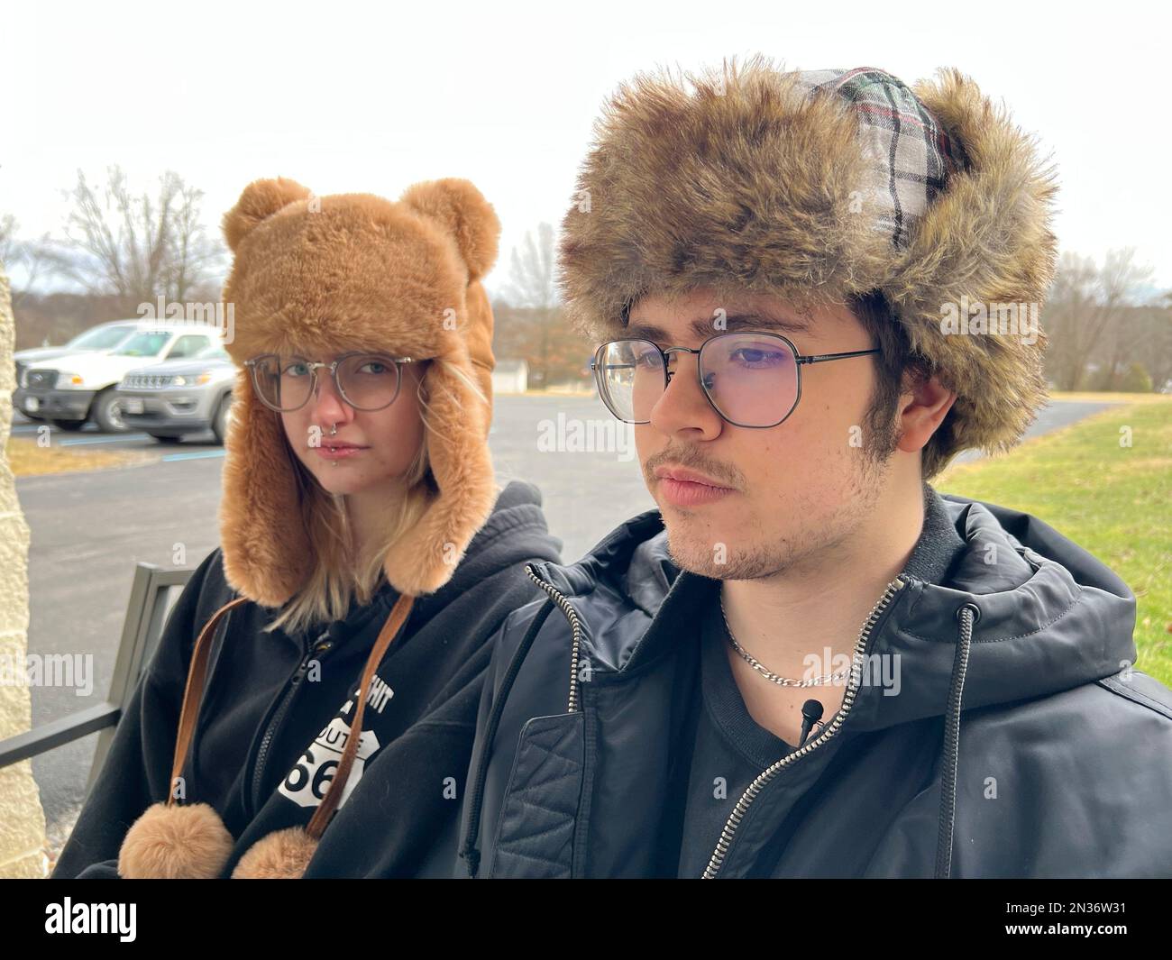 Train derailment Evacuees Anna Jurich, left, and Mason Shields sit ...