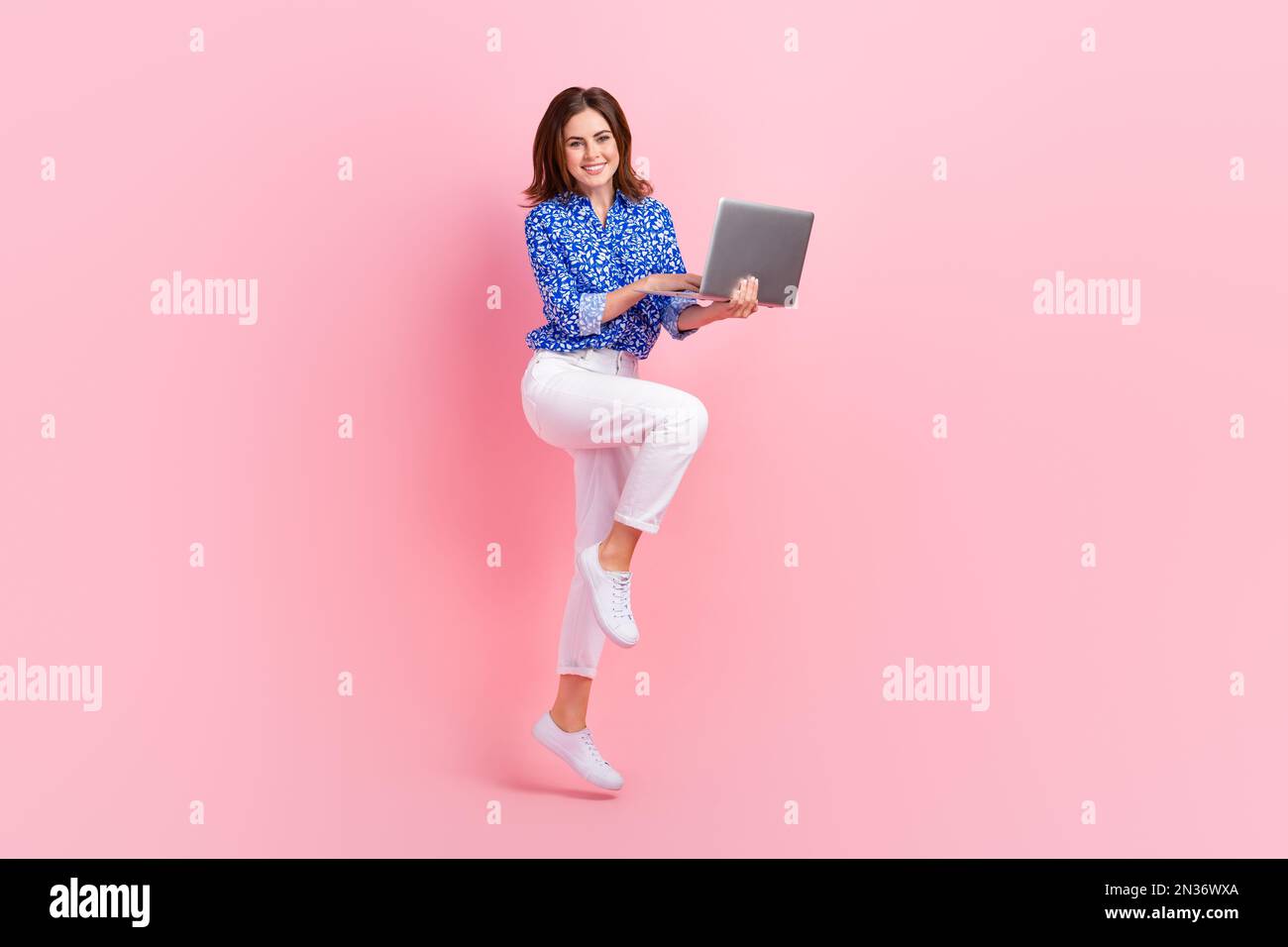 Full length photo of excited cute woman dressed blue blouse jumping ...