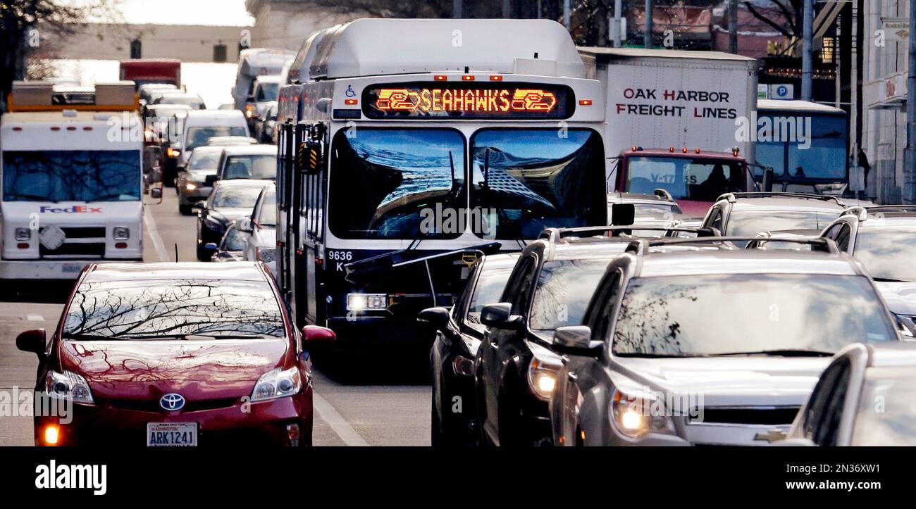 A Sound Transit bus rotates a "Seahawks" logo with its route number as ...