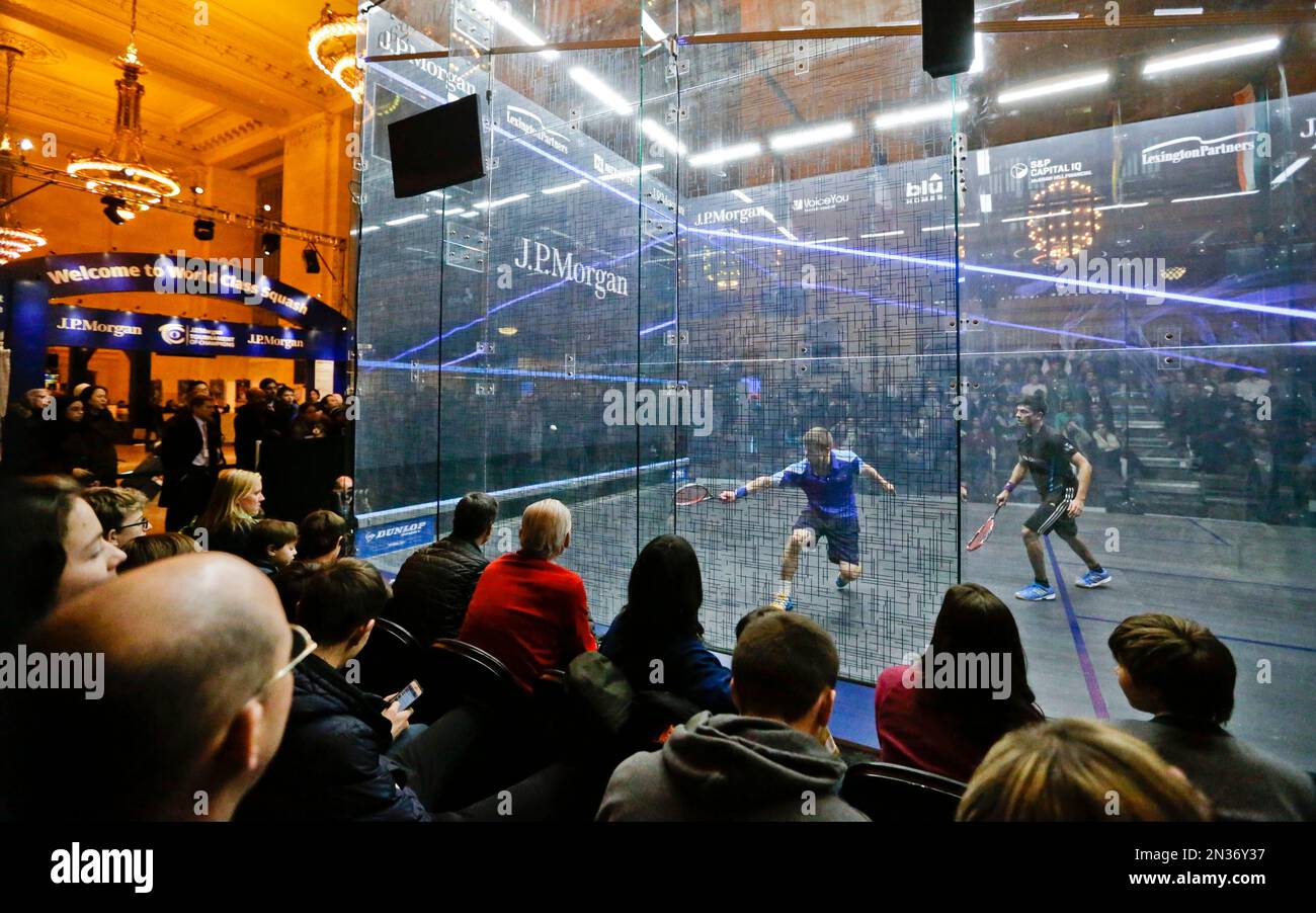 Fans watch Alan Clyne, of Scotland, center, return a shot to Saurav ...