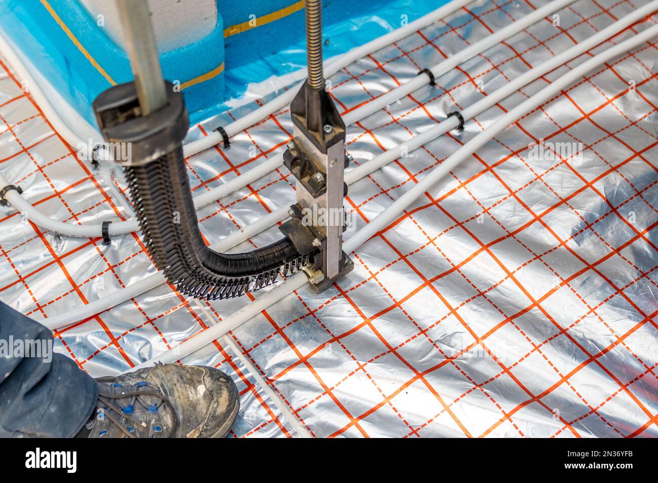 staple tacker gun for underfloor heating pipes Stock Photo - Alamy