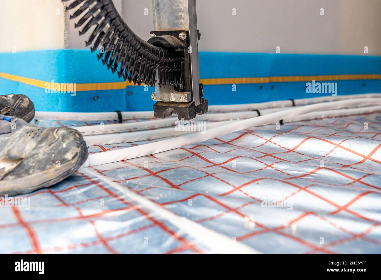 staple tacker gun for underfloor heating pipes Stock Photo - Alamy