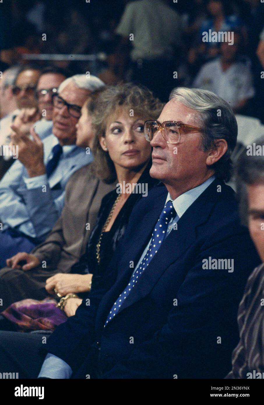 Actor Gregory Peck and his wife Veronique, attend the boxing match ...