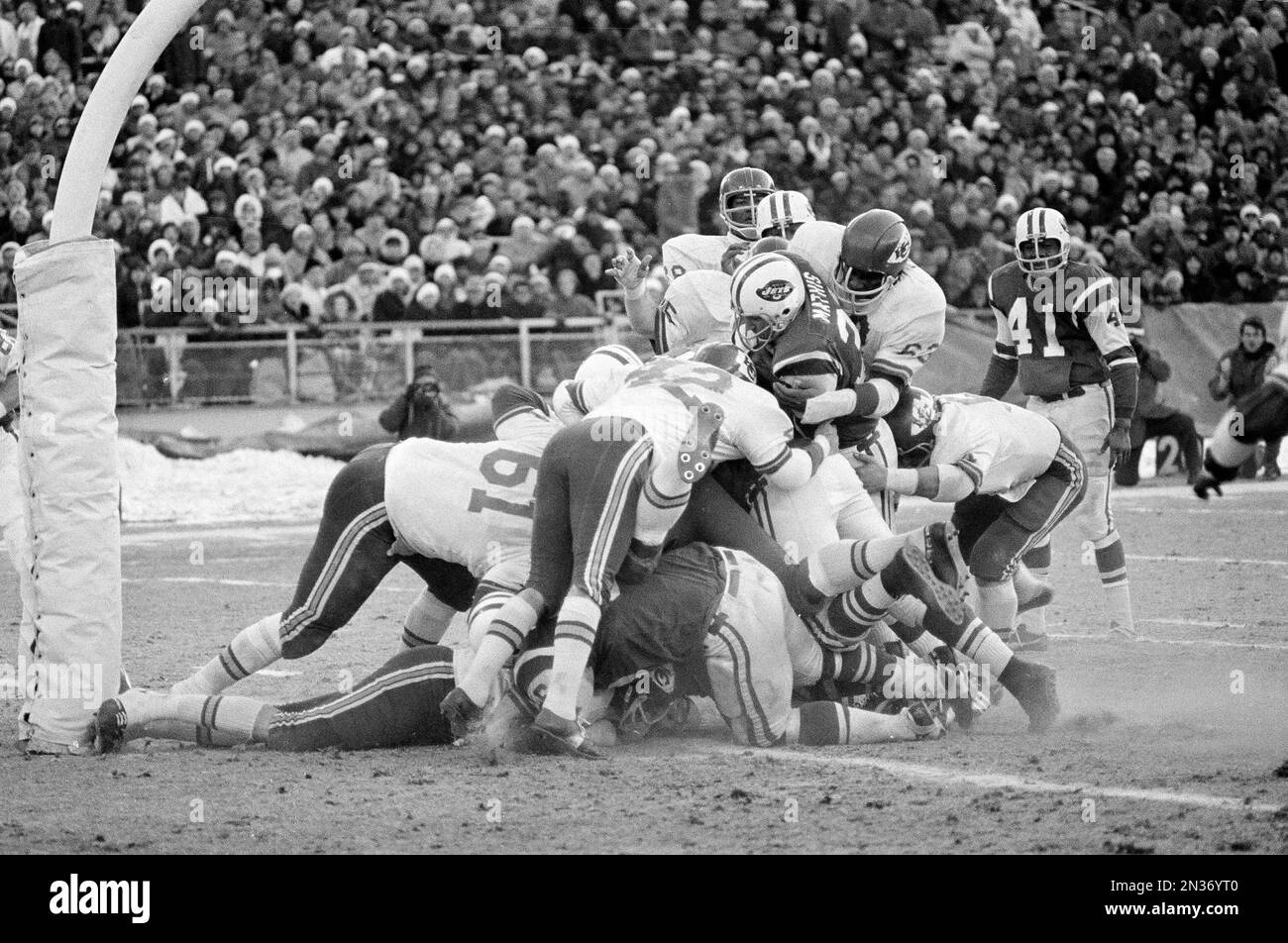 Bill Mathis of the New York Jets is stopped at the goal line by the ...