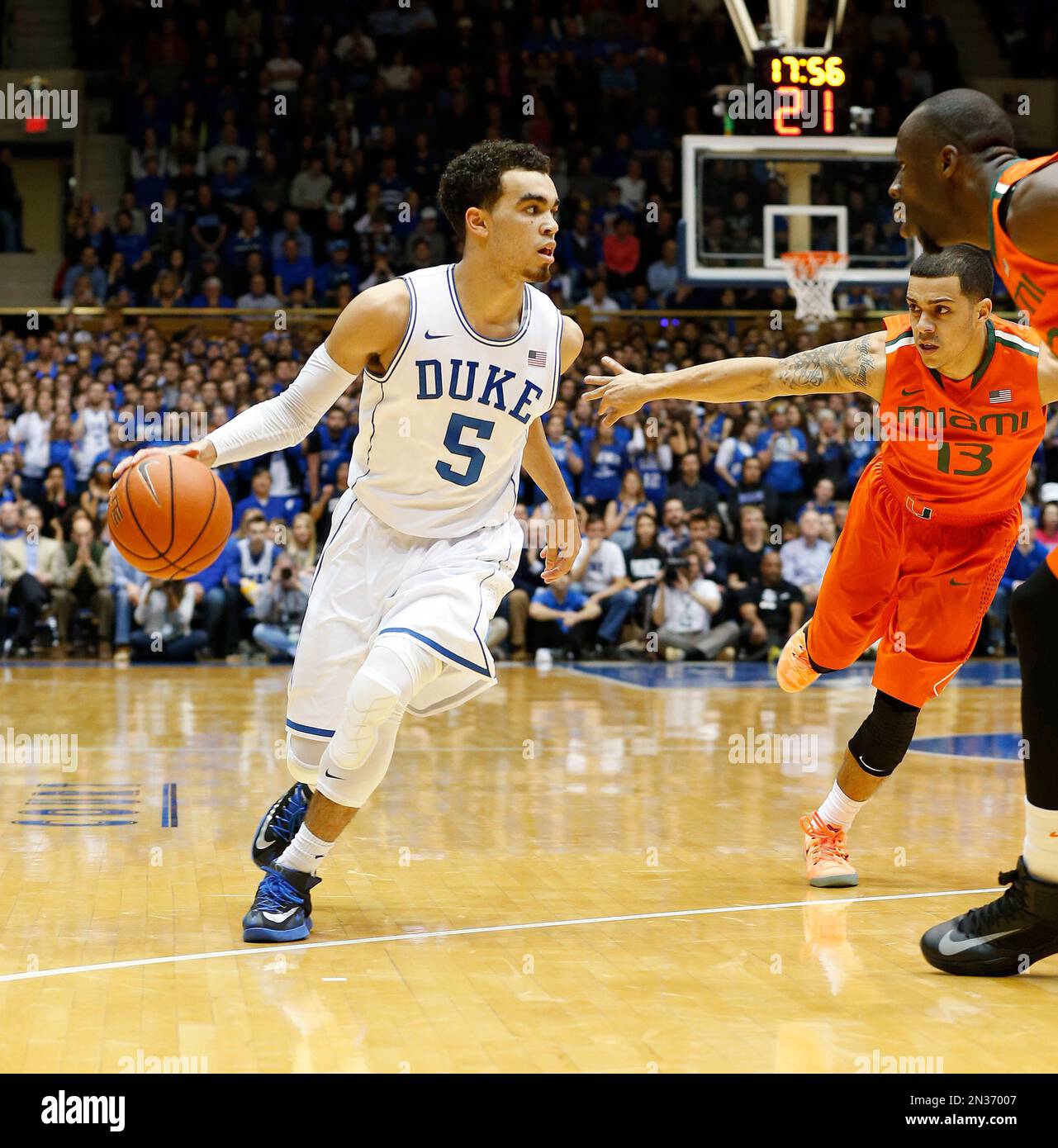 Duke's Tyus Jones (5) moves the ball up the court against Miami's Angel ...