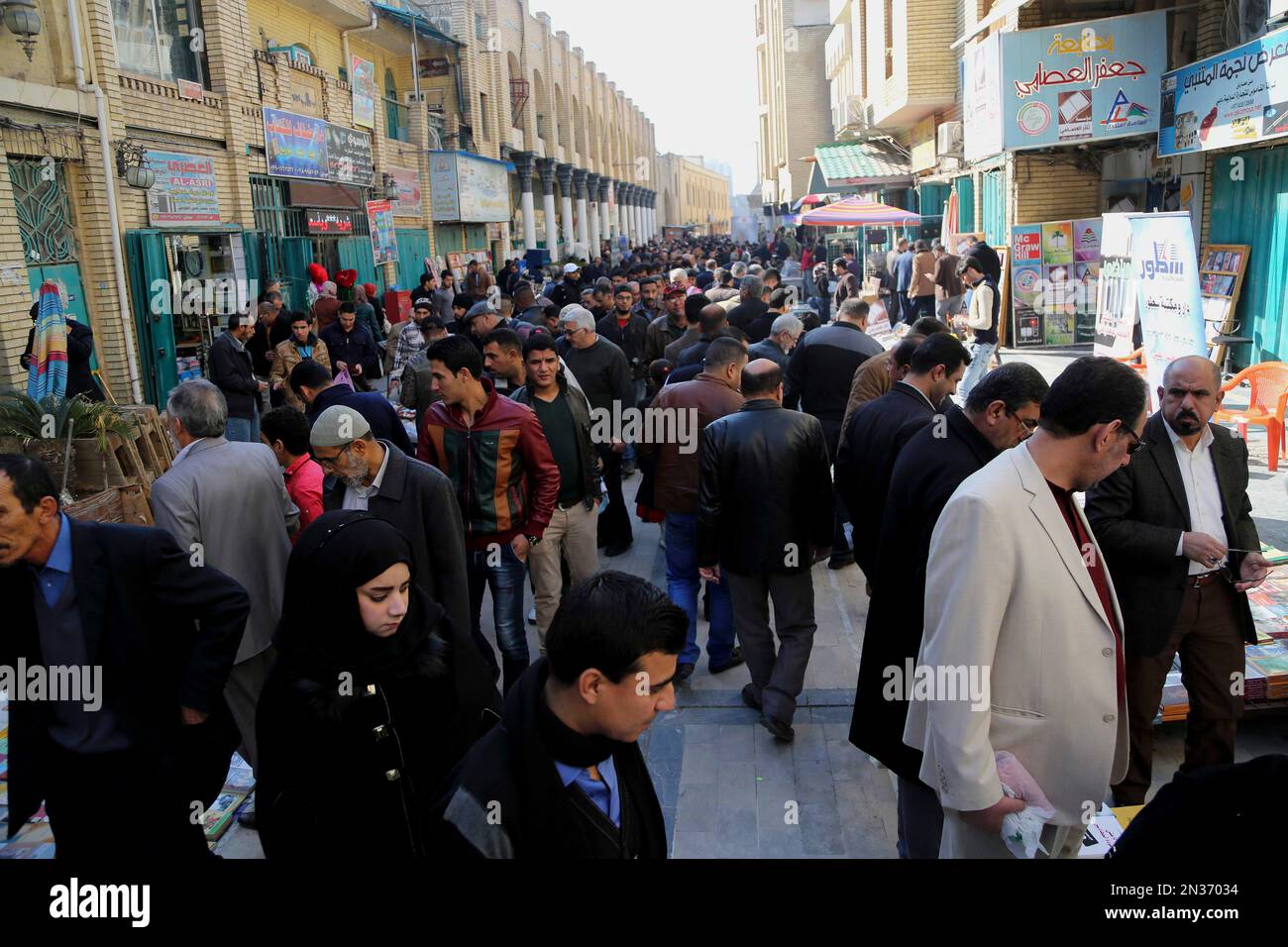 Iraqis shop for books on al-Mutanabi Street, home to the city's book ...