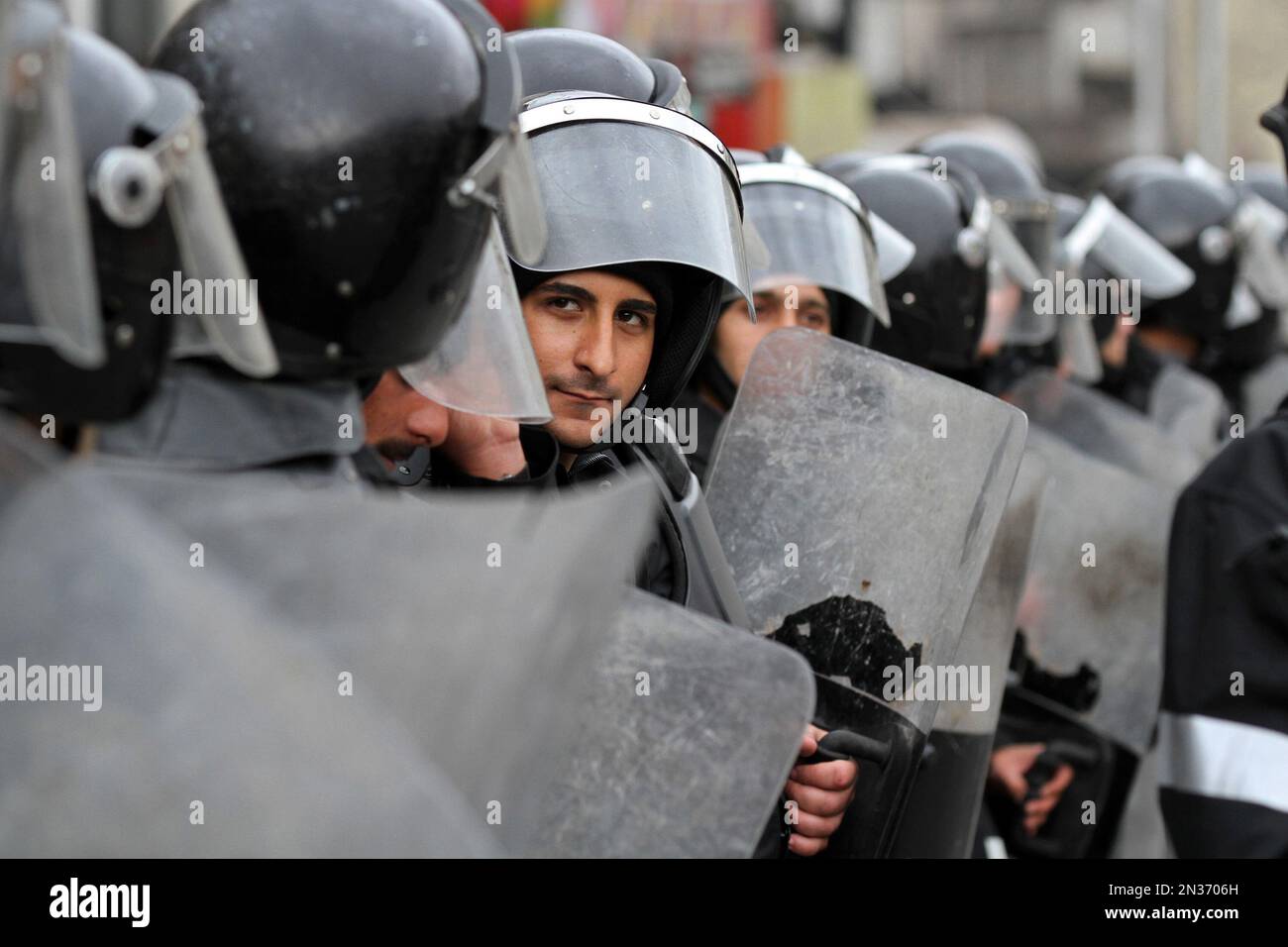 Jordanian riot police cordon off a protest against cartoons depicting ...