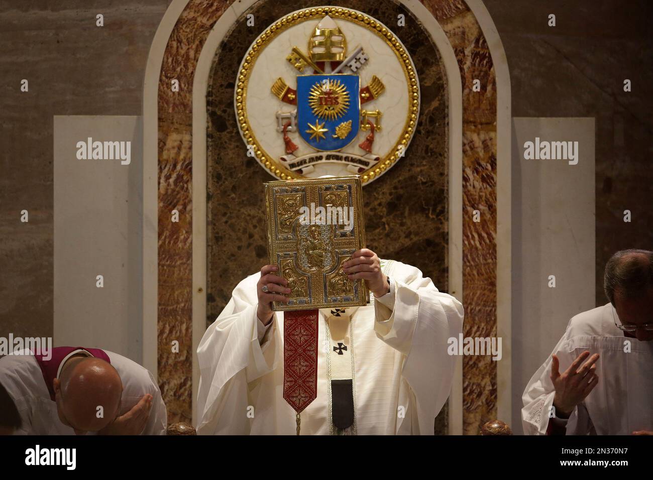 Pope Francis holds the bible during ceremonies at a mass at Cathedral ...