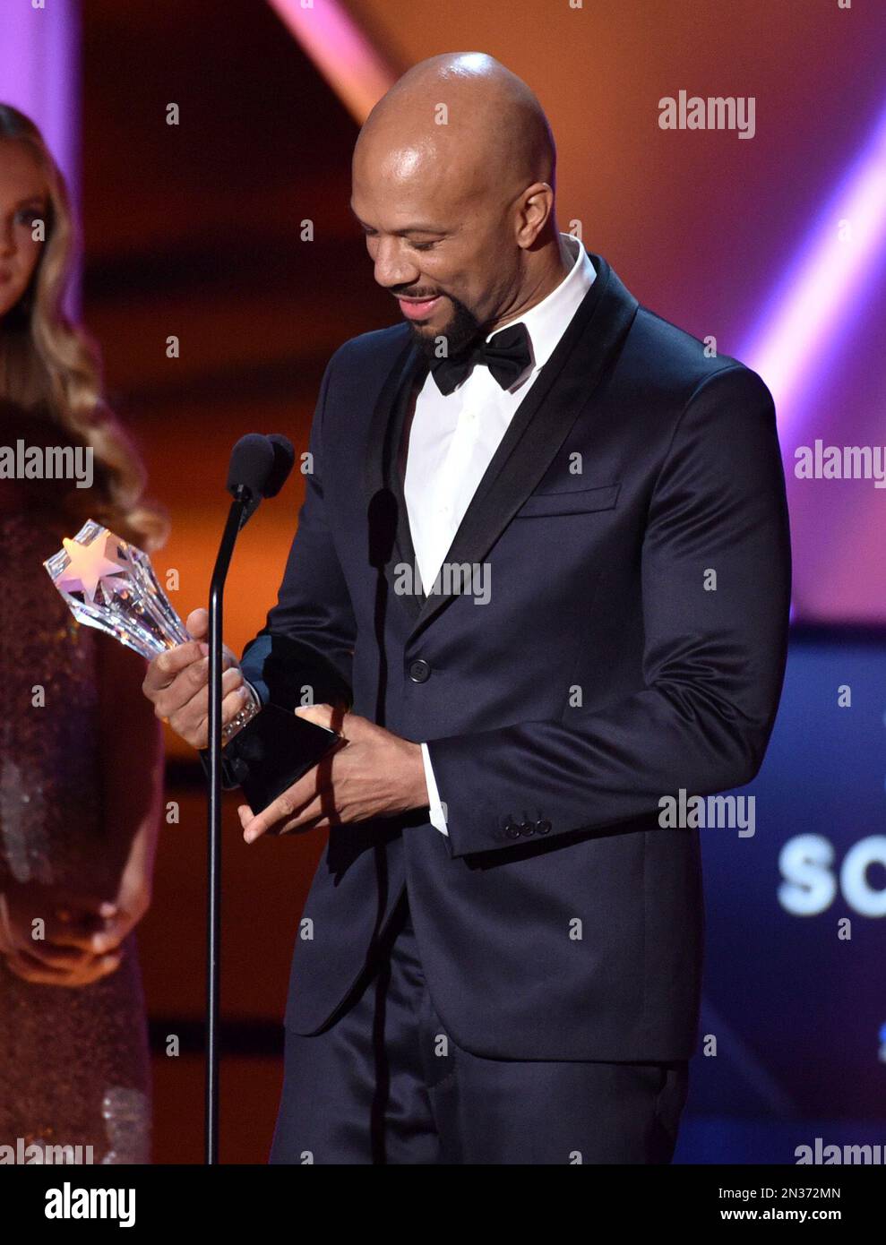 Common accepts the best song award for the song “Glory” from “Selma” at ...