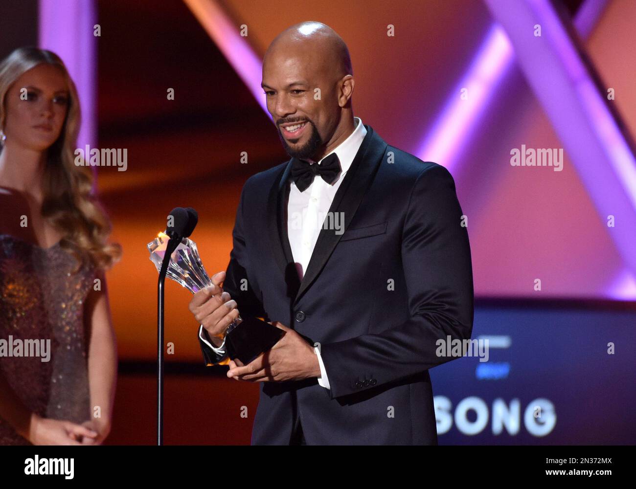 Common accepts the best song award for the song “Glory” from “Selma” at ...