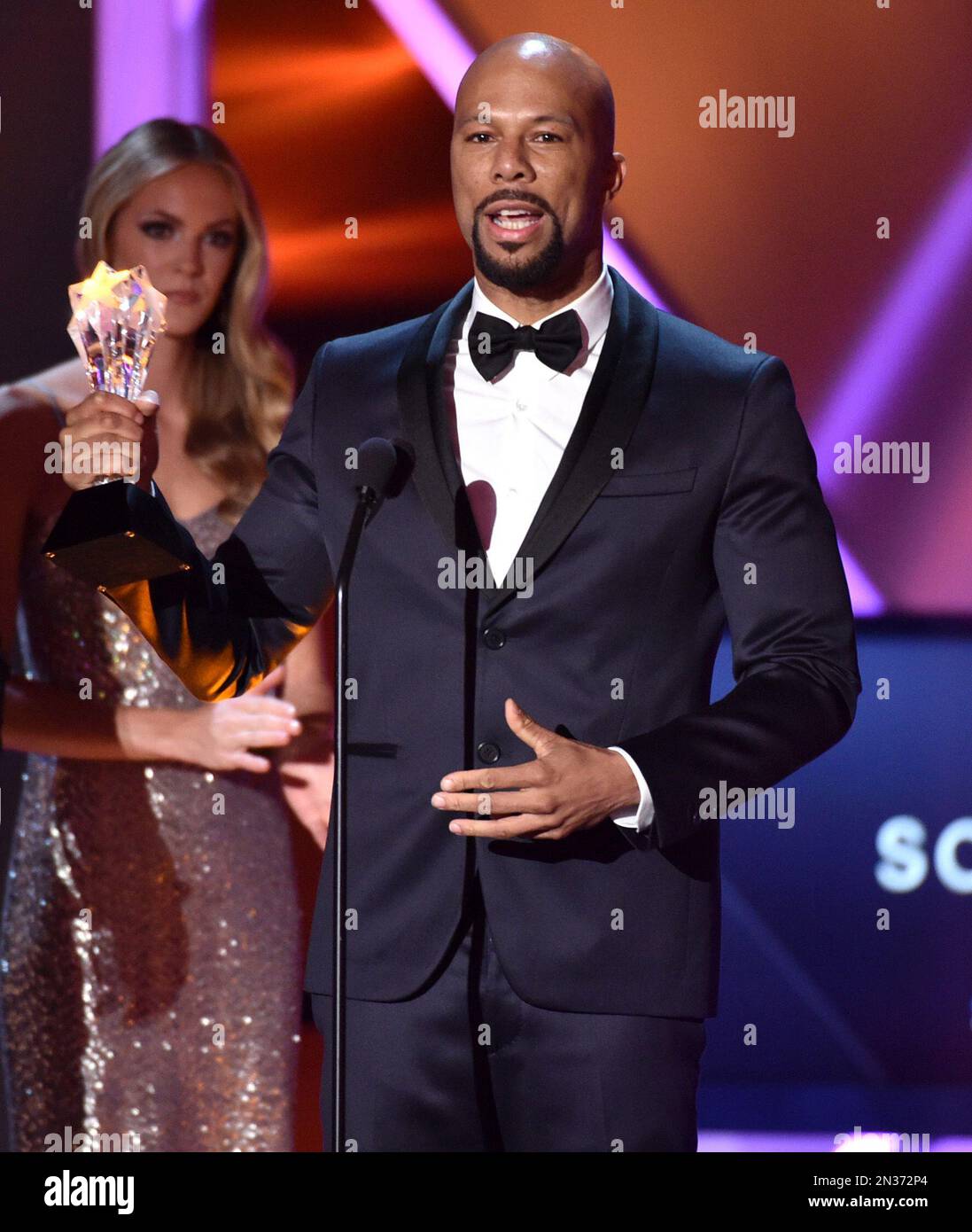 Common accepts the best song award for the song “Glory” from “Selma” at ...
