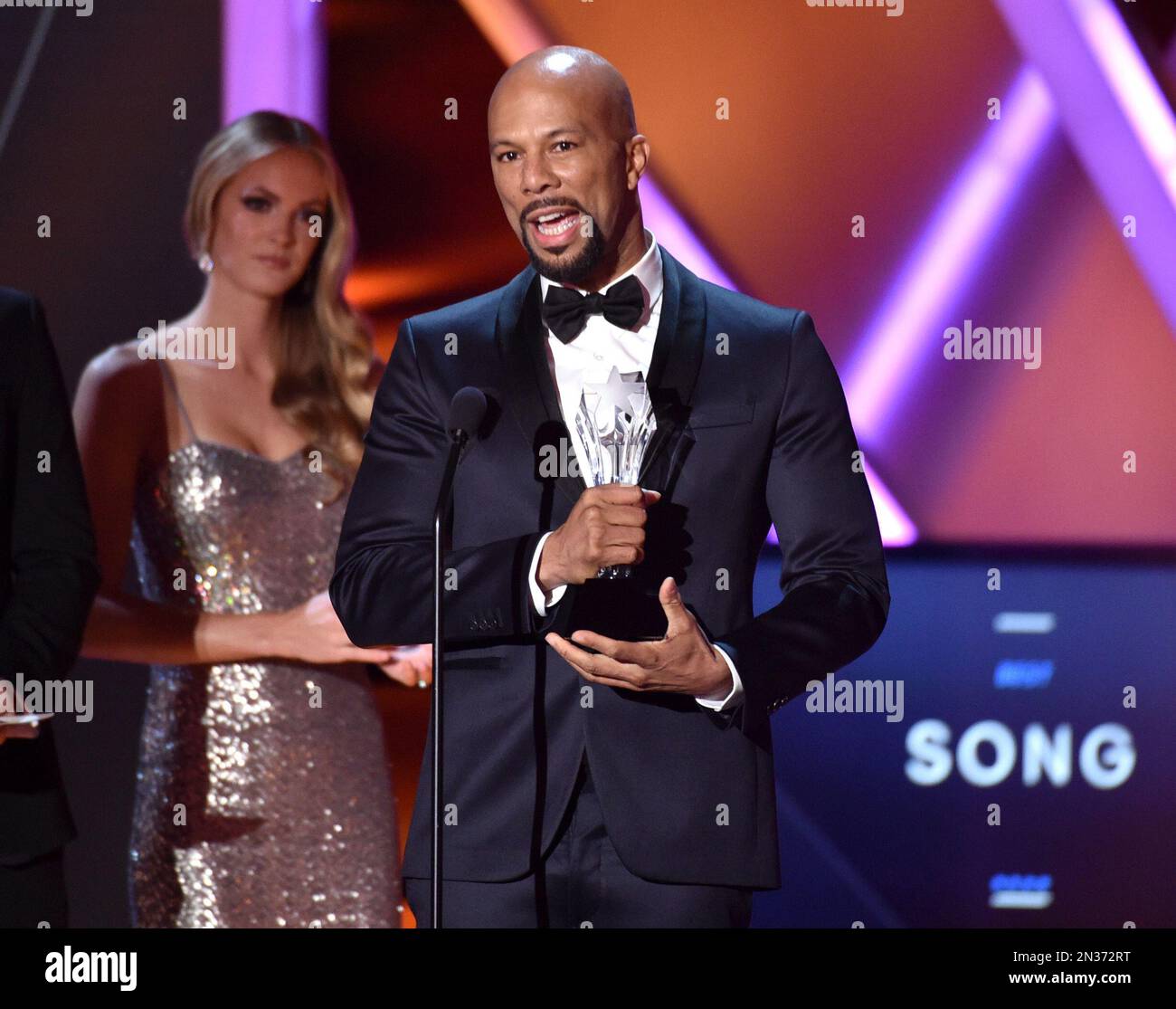 Common accepts the best song award for the song “Glory” from “Selma” at ...