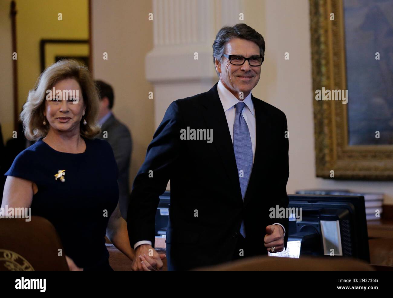 Texas Gov. Rick Perry, right, with his wife, Anita, left, arrives to ...