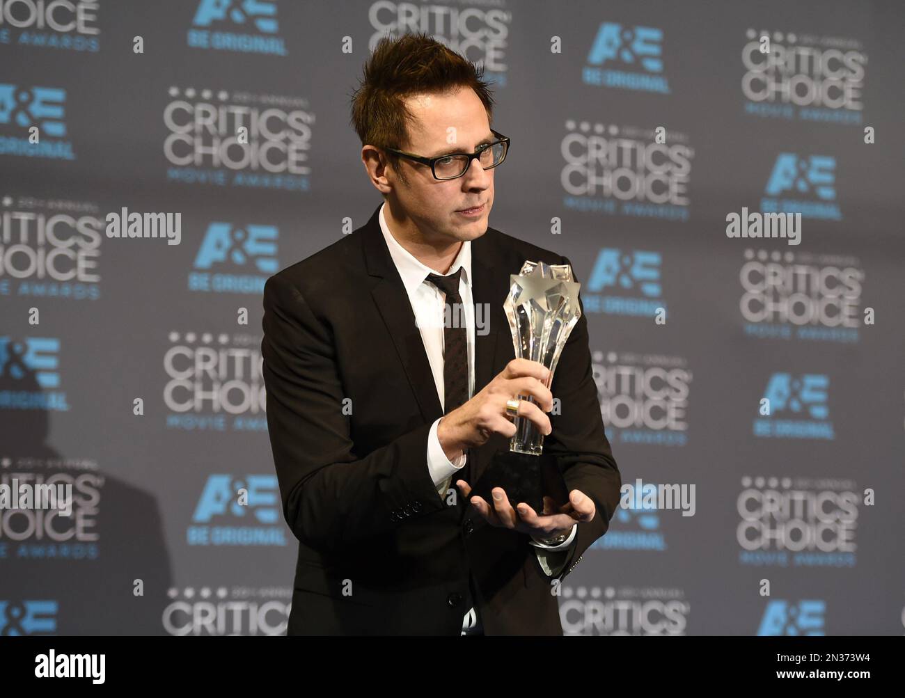 James Gunn poses in the press room with the best action movie award for ...