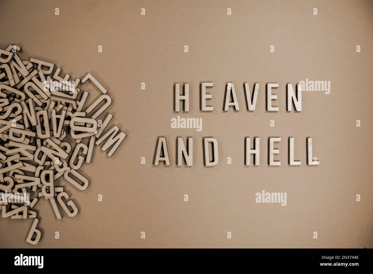 HEAVEN AND HELL in wooden English language capital letters spilling ...