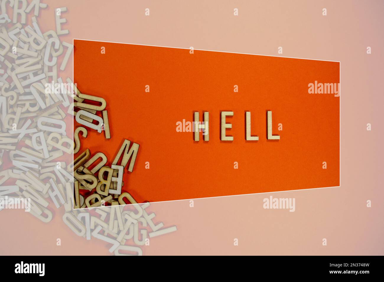 HELL in wooden English language capital letters spilling from a pile of ... HELL in wooden English language capital letters spilling from a pile of ...