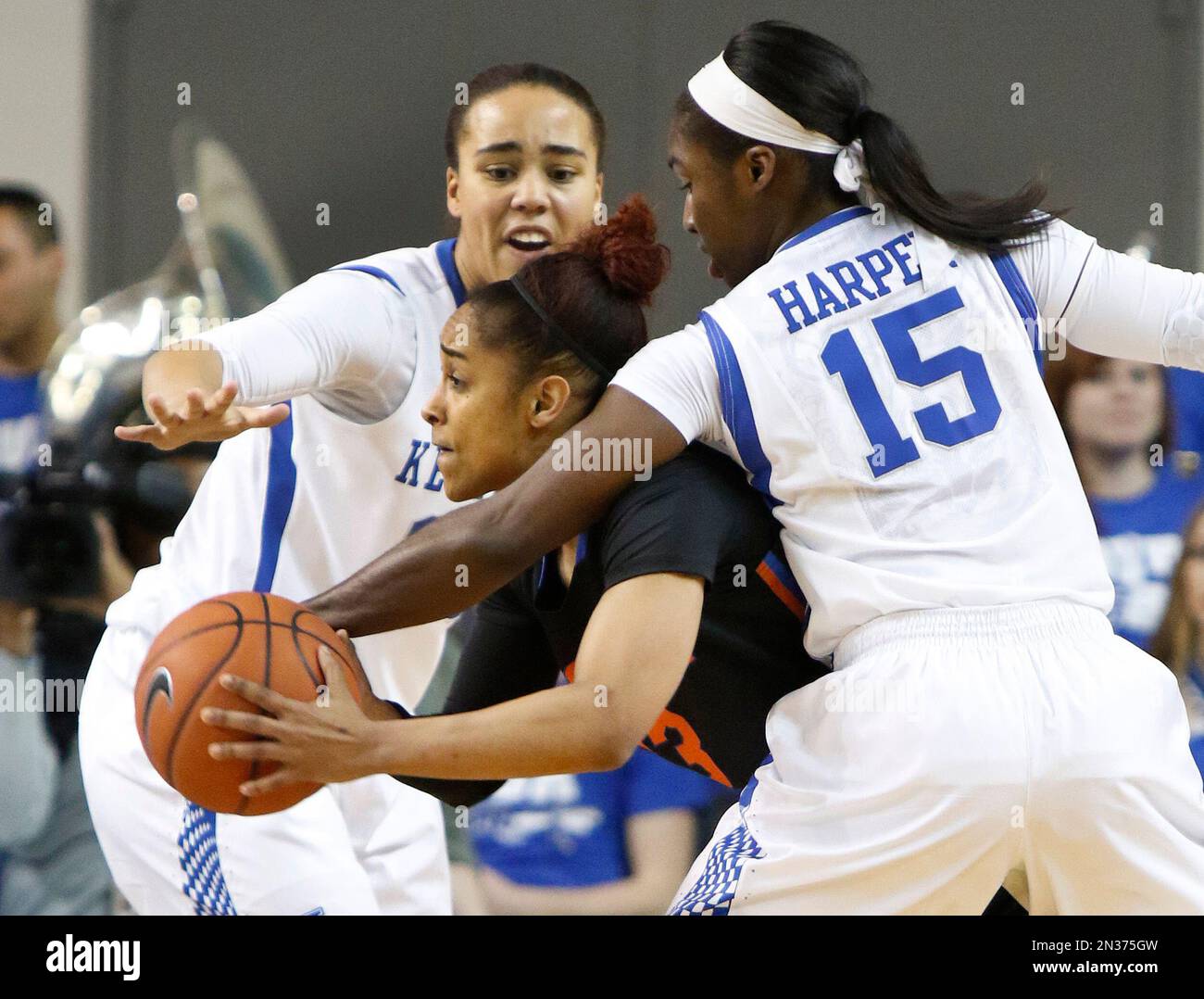 Florida's Cassie Peoples, middle, looks for an opening between Kentucky ...