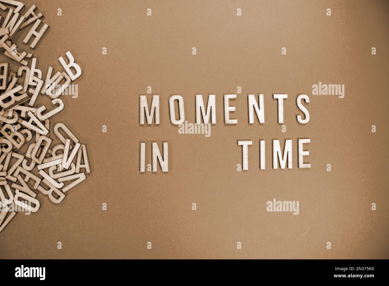 MOMENTS IN TIME in wooden English words language capital letters ...