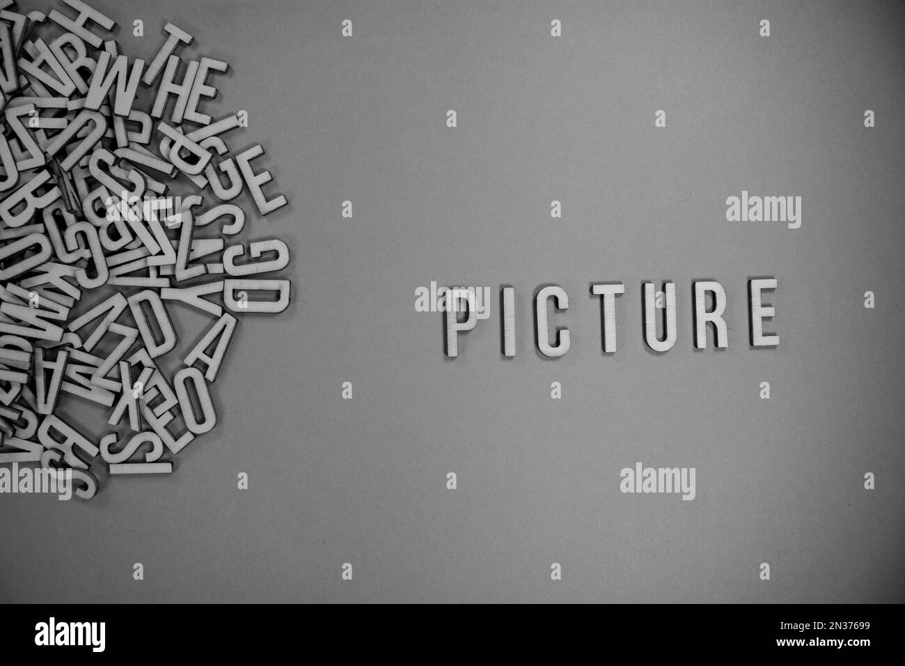 PICTURE in wooden English words language capital letters spilling from ...