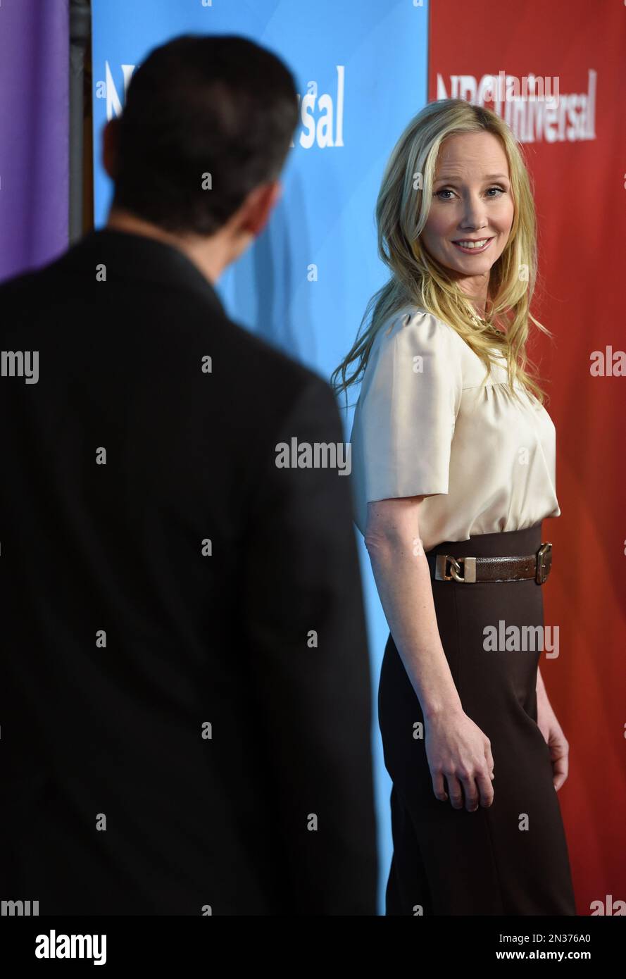 Anne Heche, right, a cast member in the USA series "Dig," looks over at ...