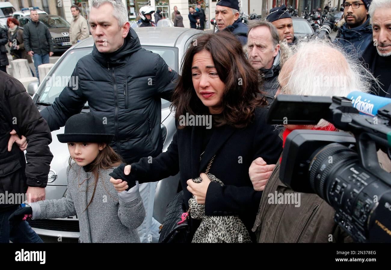 Daughter of French cartoonist Georges Wolinski, Elsa Wolinski, centre ...