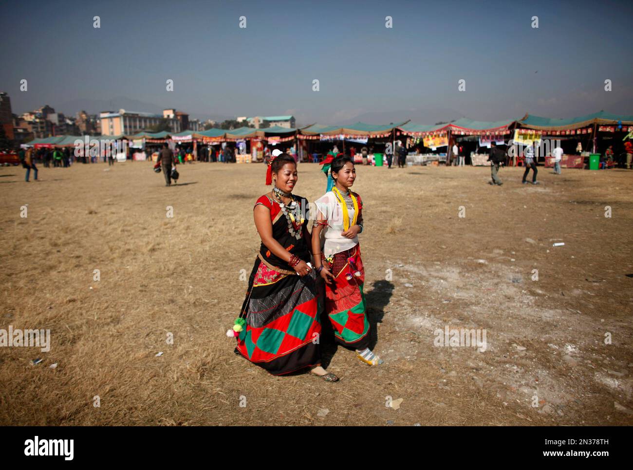 Nepalese Tharu ethnic community women in their traditional attire attend the Maghi festival ...