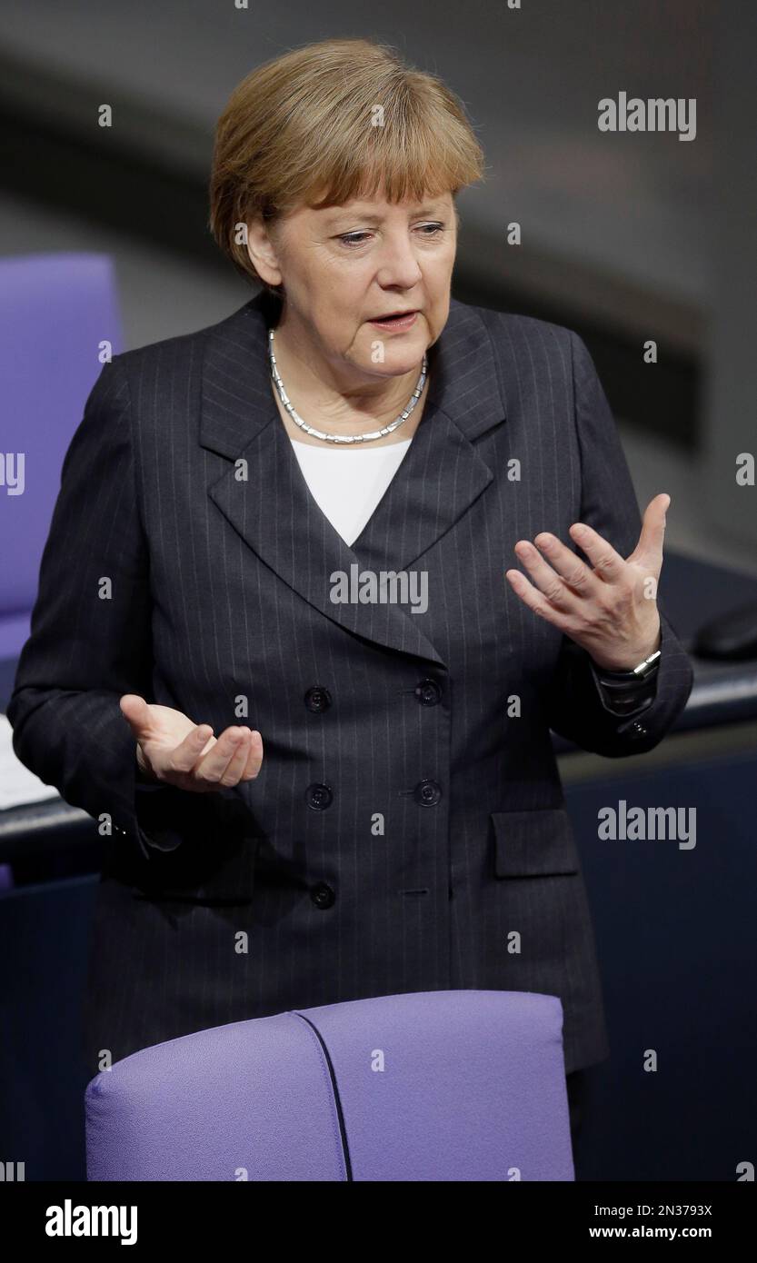 German Chancellor Angela Merkel speaks as she arrivers for a meeting of ...