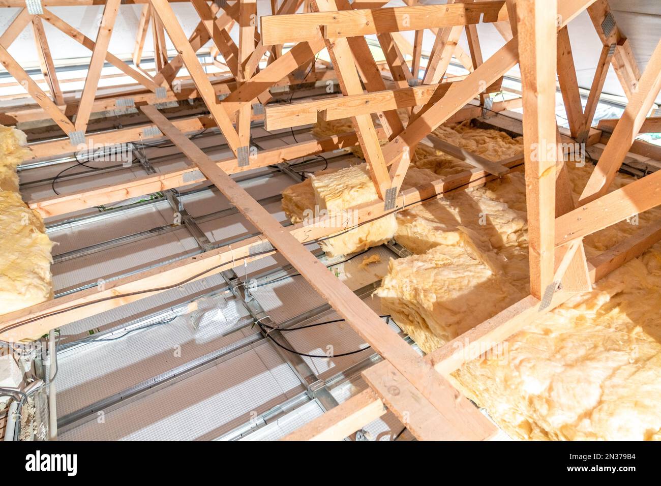 insulation of the roof and ceiling with glass wool Stock Photo - Alamy