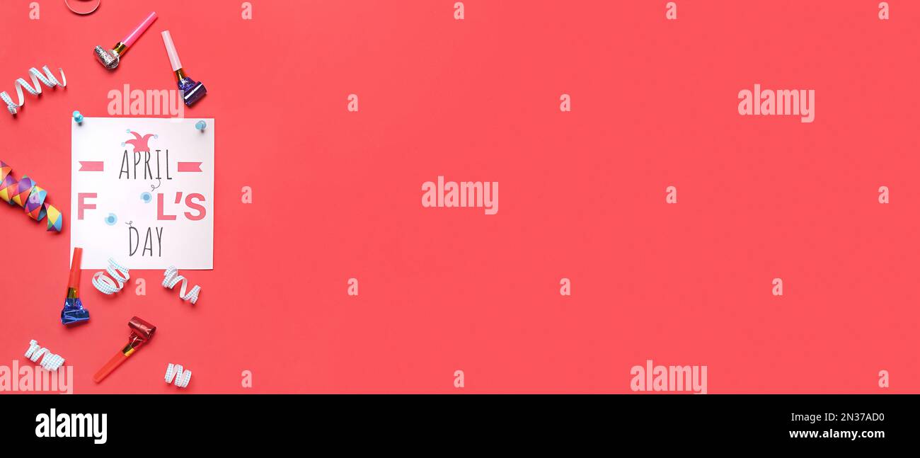 Card with text APRIL FOOL'S DAY, streamers and noisemakers on red ...