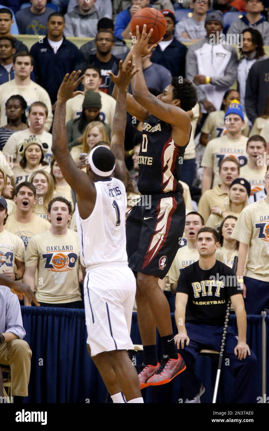 Florida State's Phil Cofer (0) shoots over Pittsburgh's Jamel Artis (1 ...