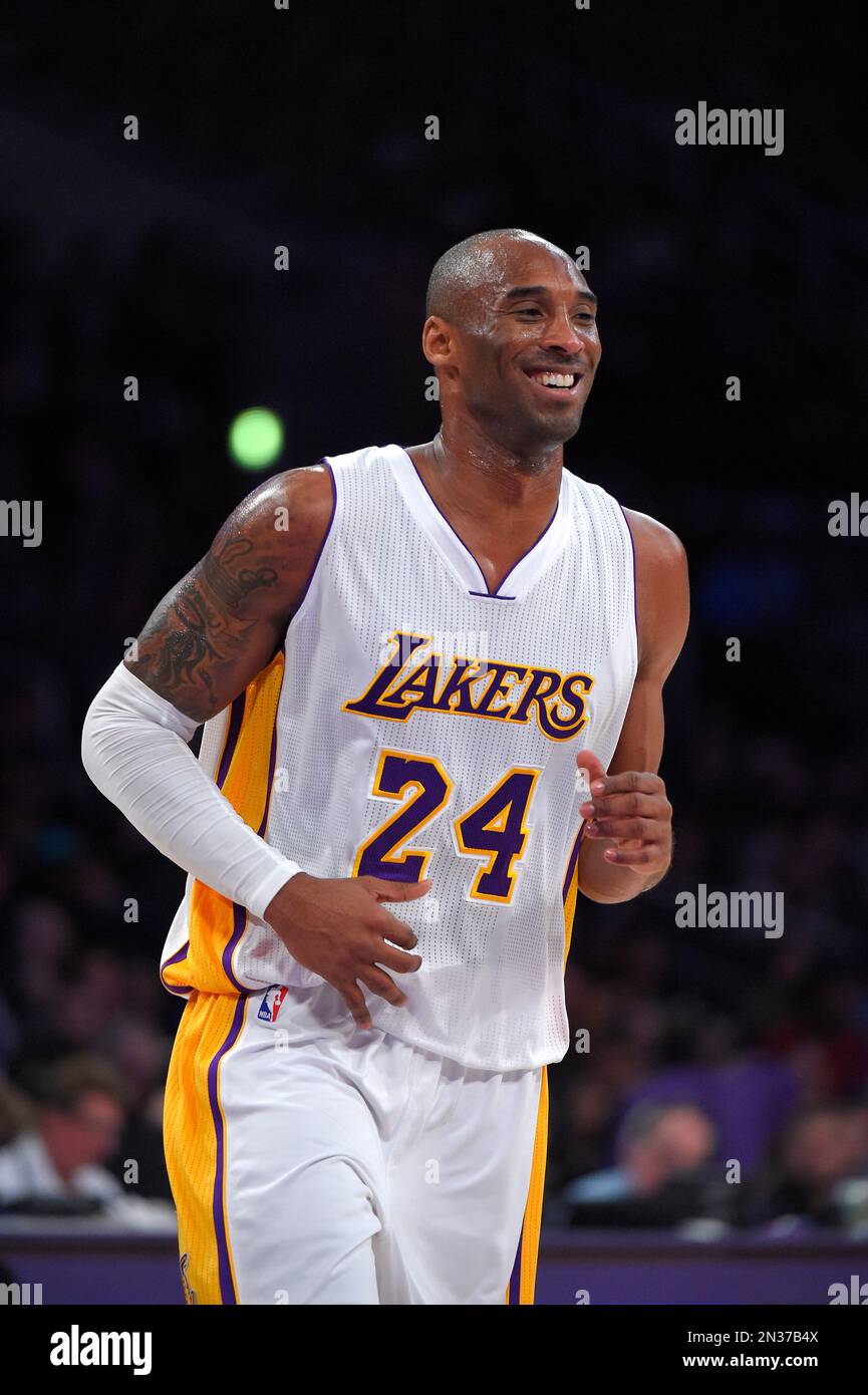 Los Angeles Lakers guard Kobe Bryant smiles after scoring during the ...