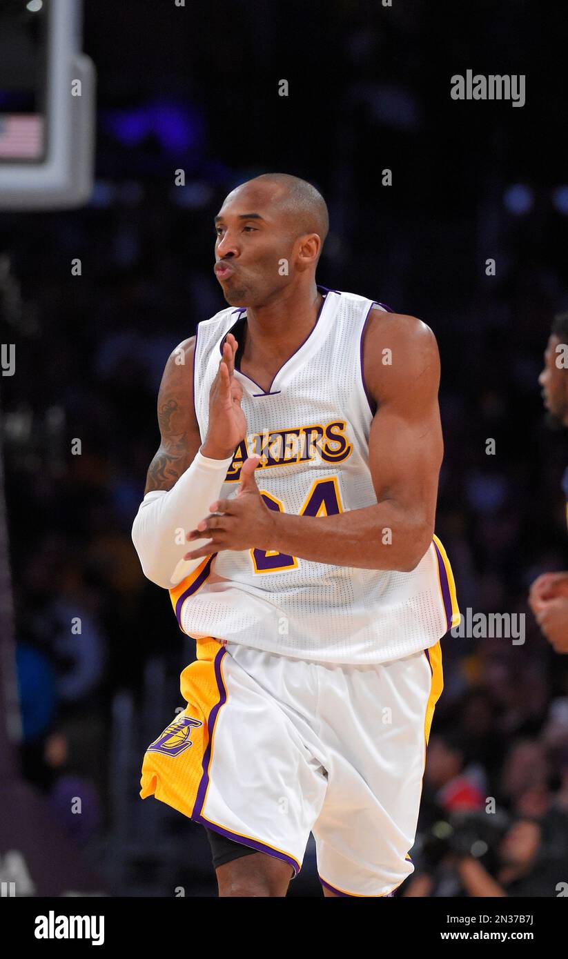 Los Angeles Lakers guard Kobe Bryant claps after scoring during the ...
