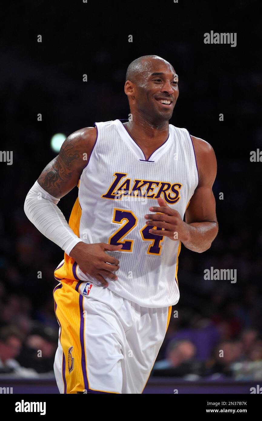 Los Angeles Lakers guard Kobe Bryant smiles after scoring during the ...