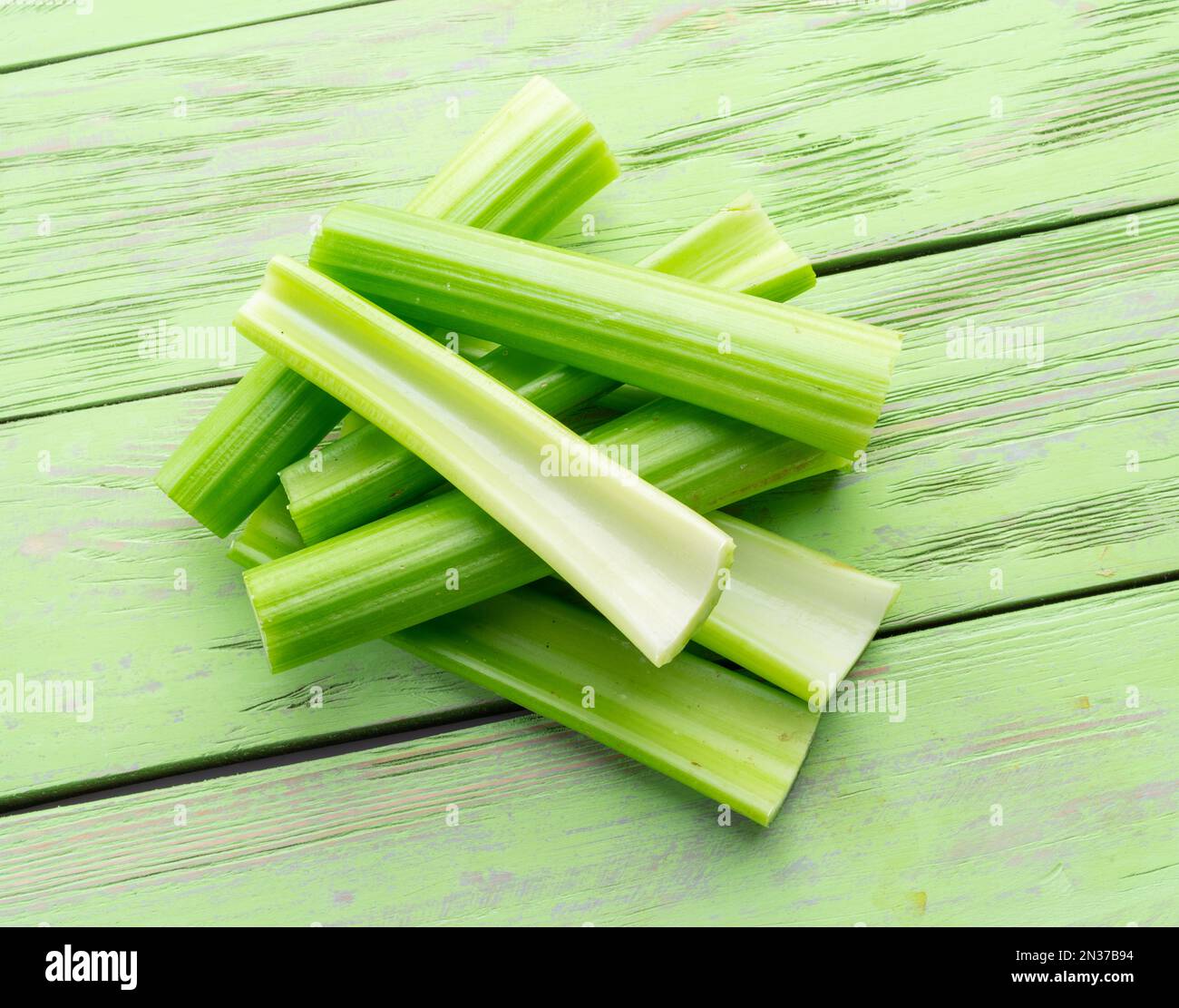 Pile of celery ribs isolated on white background Stock Photo - Alamy