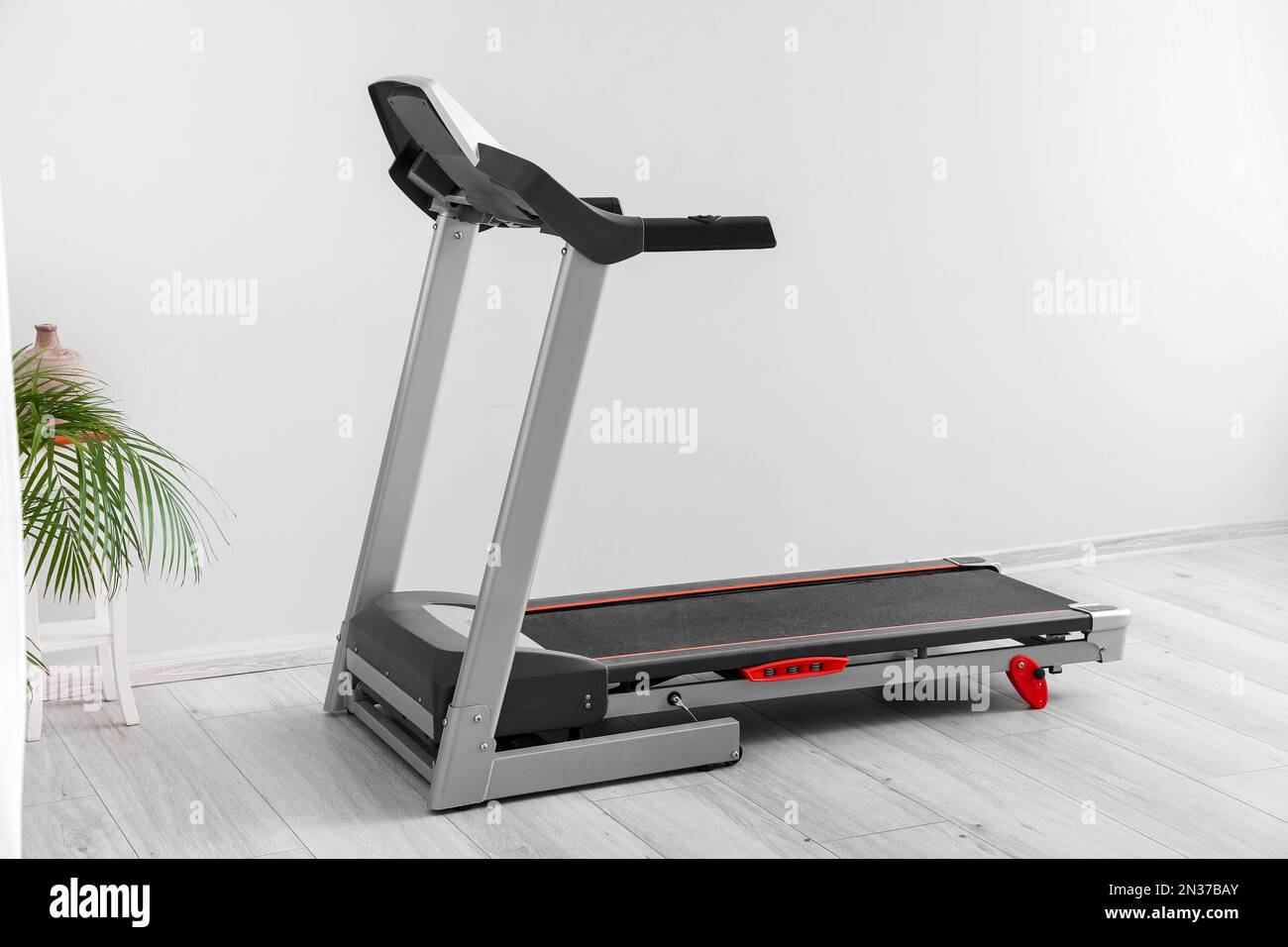 Modern treadmill in light room Stock Photo - Alamy