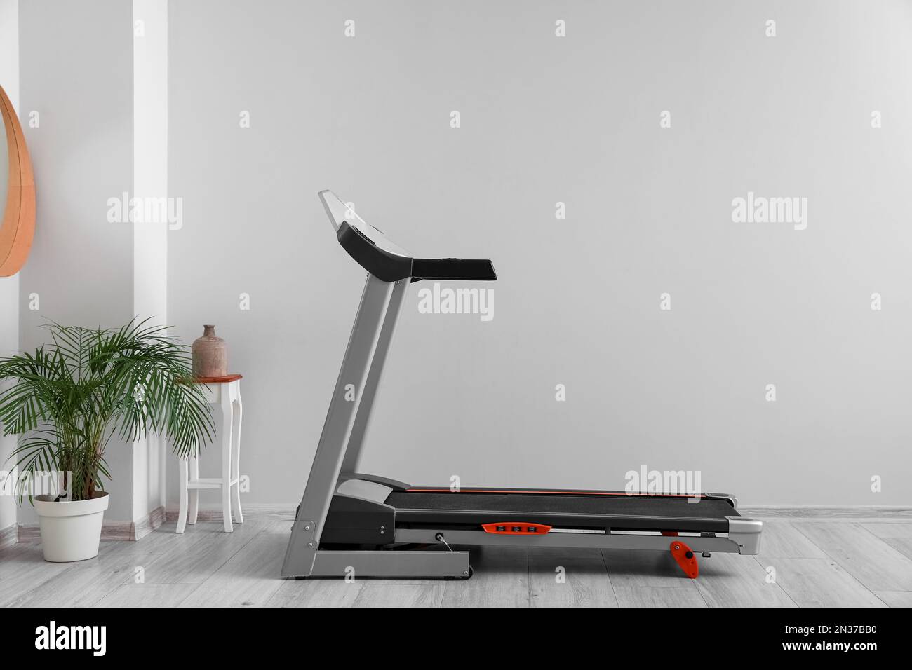 Modern treadmill in interior of light room Stock Photo - Alamy