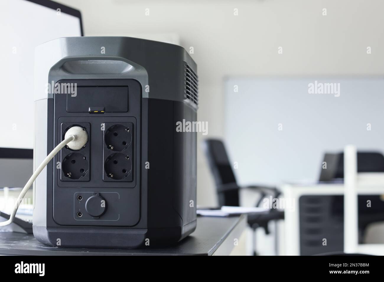 Portable power station on table in office Stock Photo - Alamy