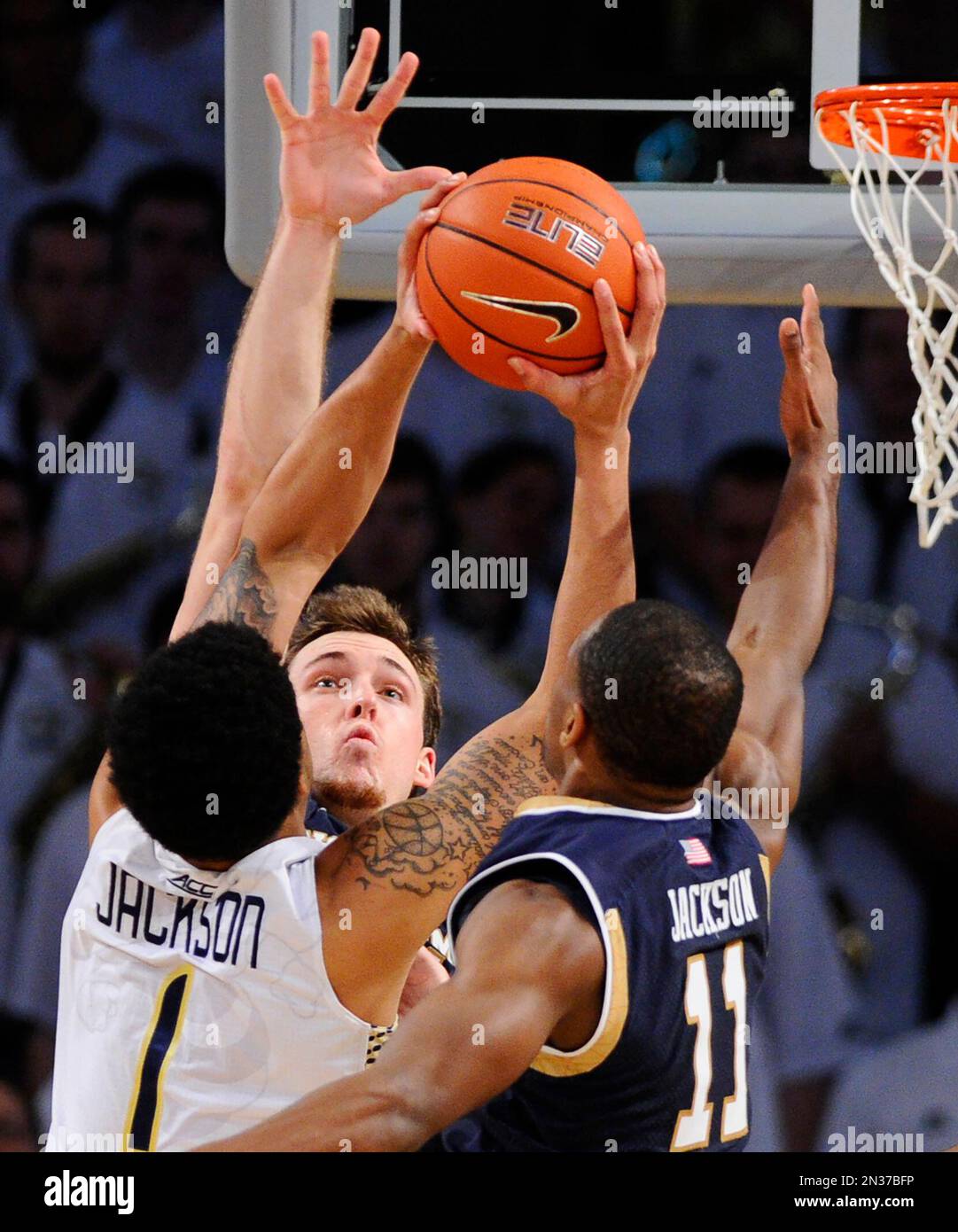 Notre Dame's Pat Connaughton, center, and Demetrius Jackson (11) block ...