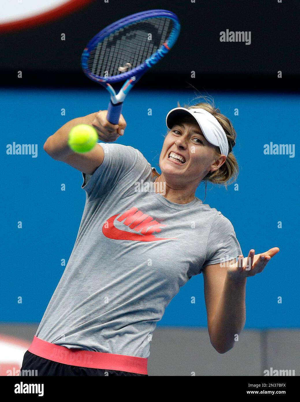 Russia's Maria Sharapova makes a forehand return during a practice ...