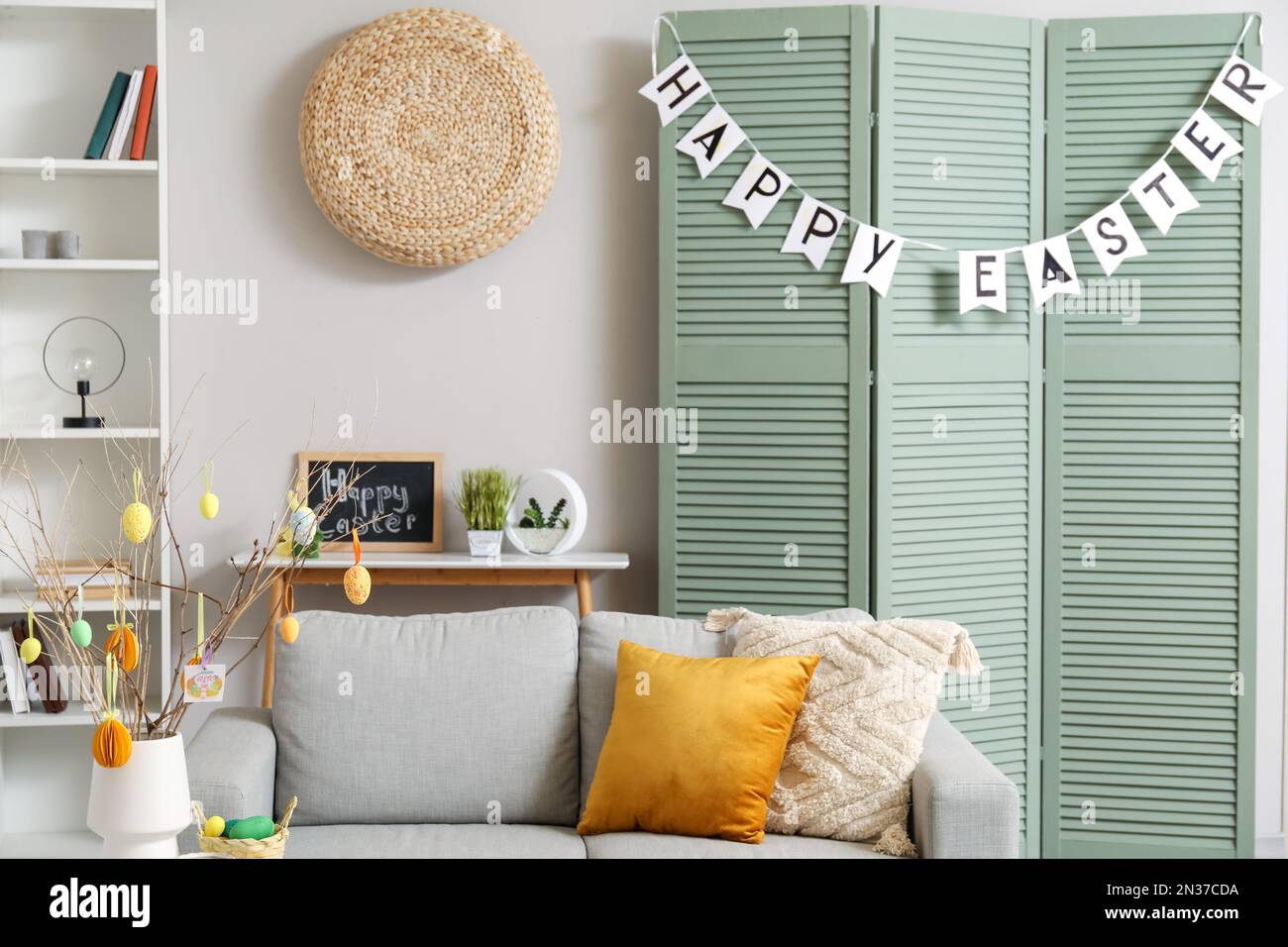 Interior of living room decorated for Easter celebration with sofa and ...