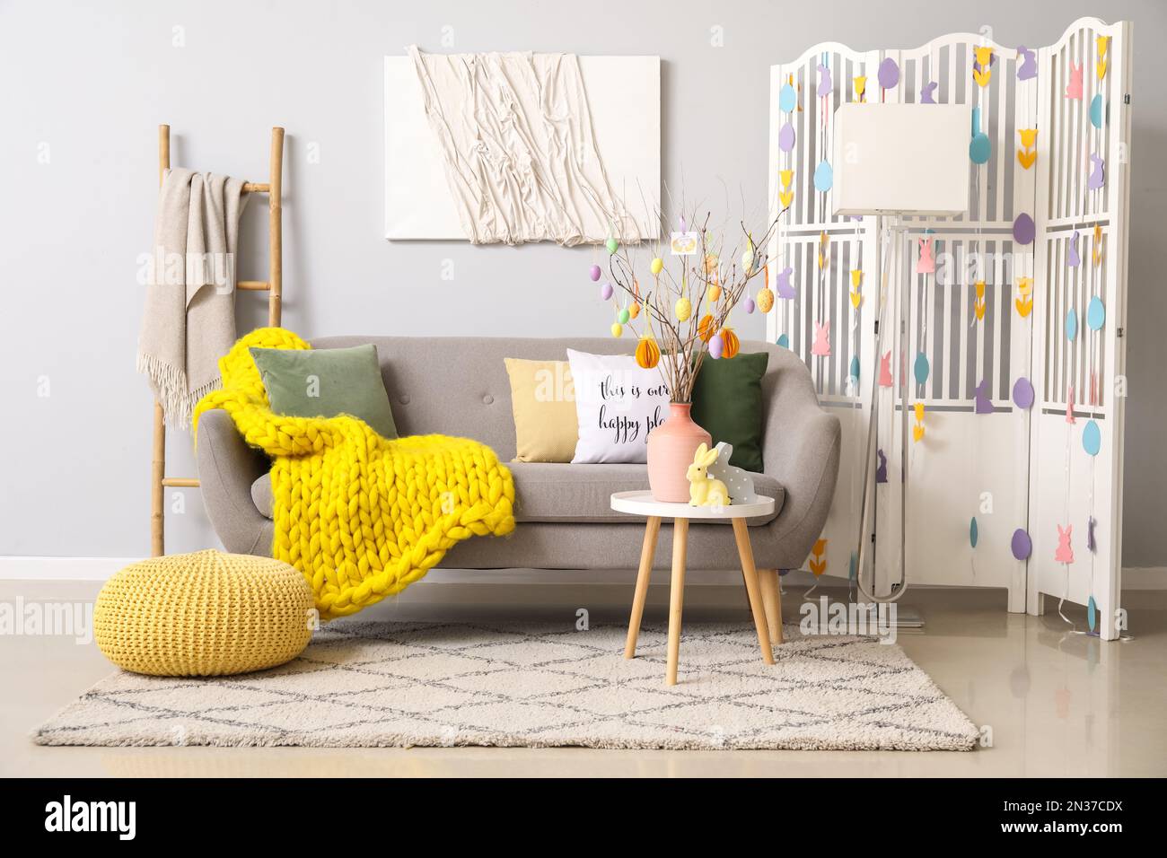 Interior of living room decorated for Easter celebration with sofa and ...