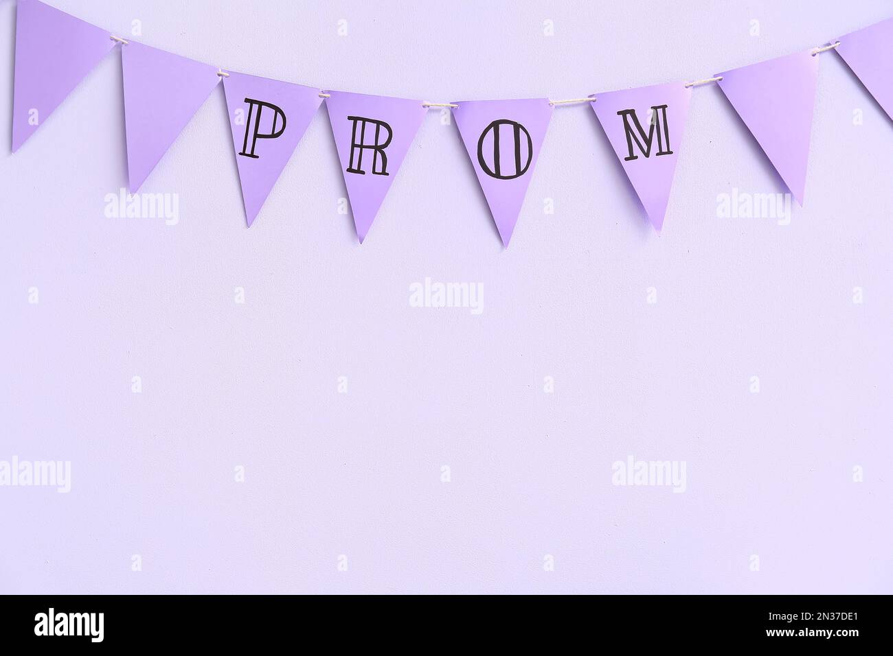 Flags with word PROM on lilac wall Stock Photo - Alamy