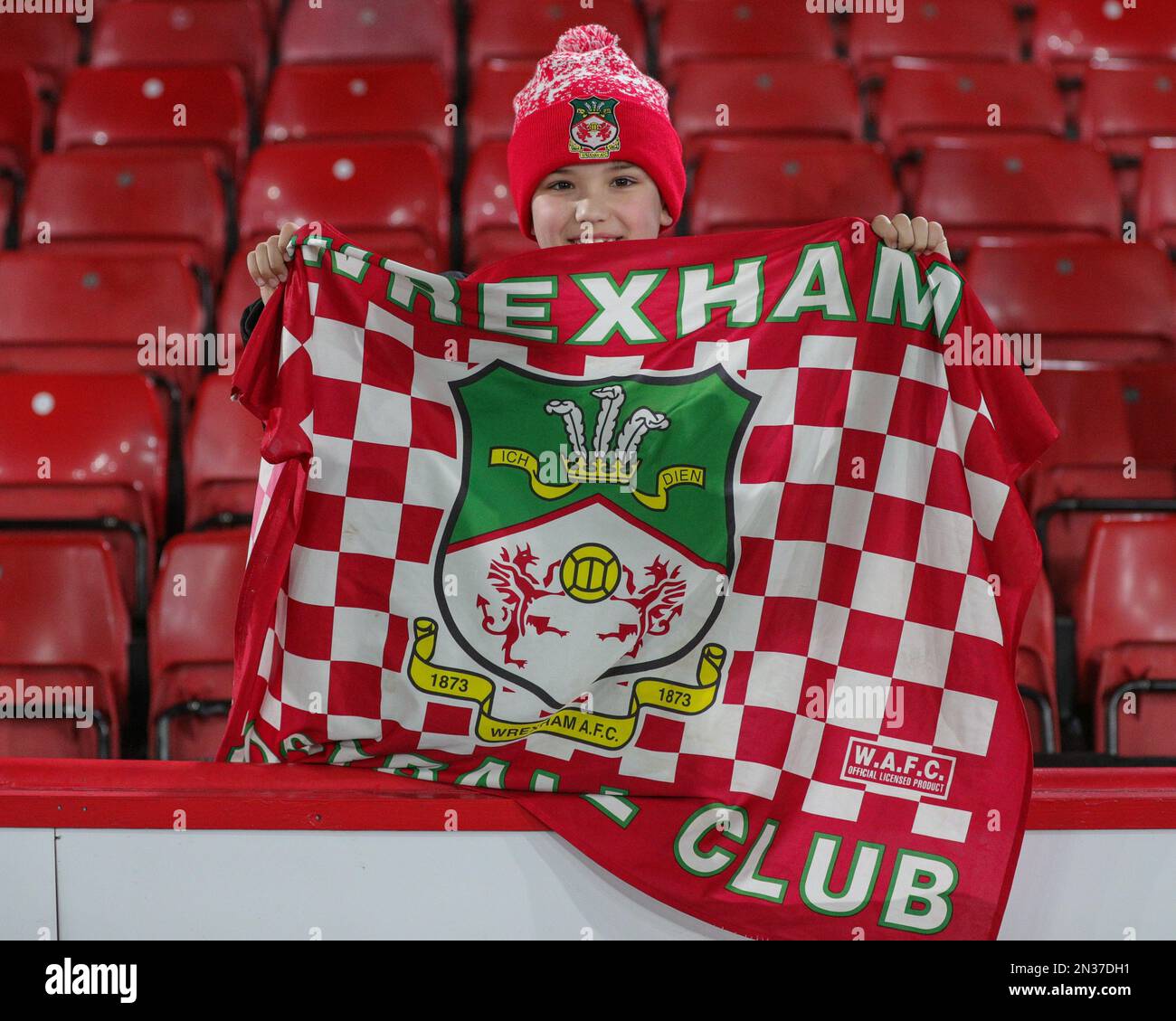 A young Wrexham fan with a club branded flag ahead of the Emirates FA ...