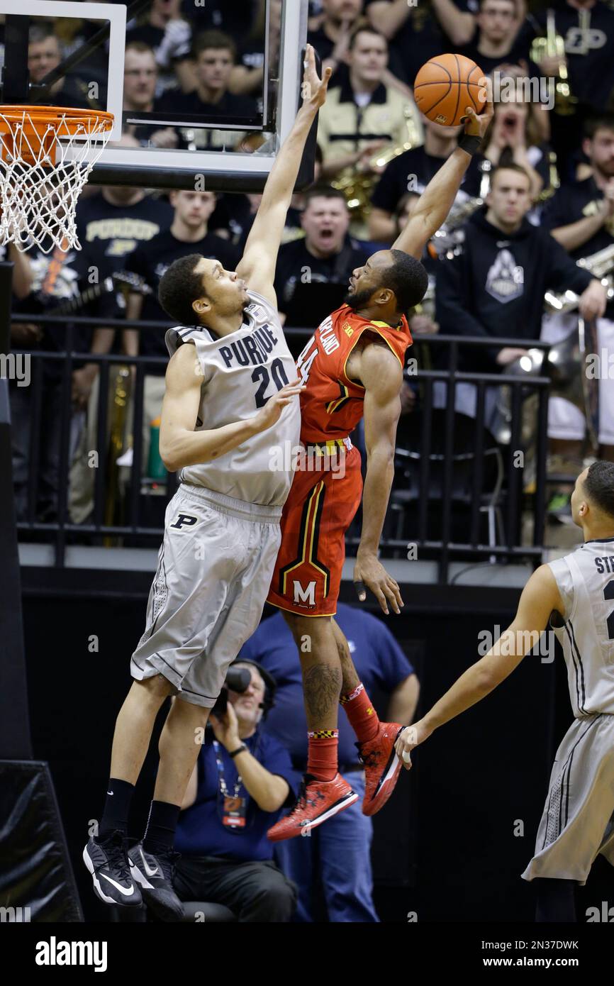 Maryland forward Dez Wells (44), right, shoots over Purdue center A.J ...