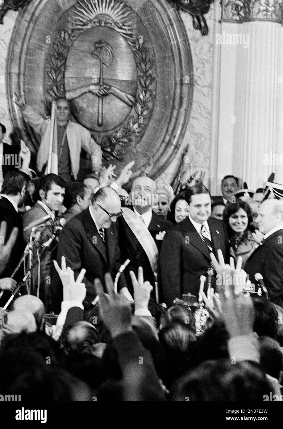 President Hector Campora, center, new leader of Argentina, acknowledges ...